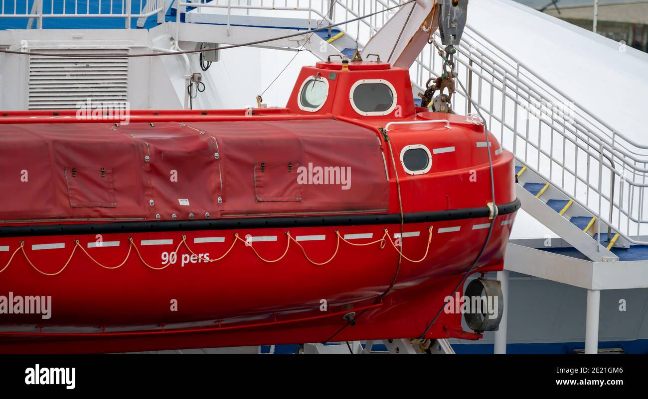 Large industrial life boat in bright orange color Stock Photo - Alamy