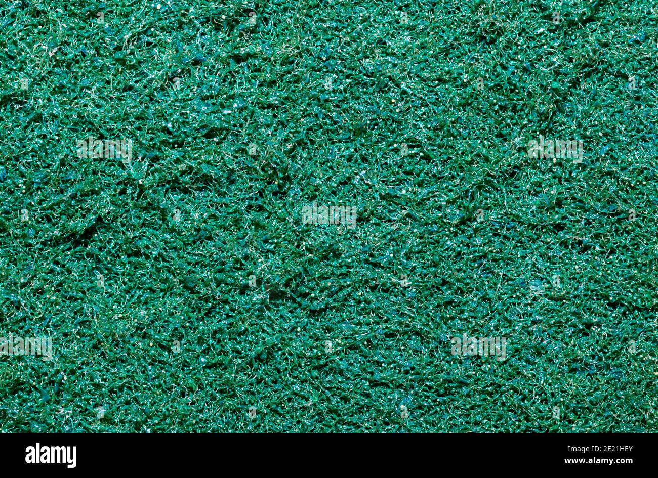 Abstract top view of green synthetic fiber texture background. Close-up ...
