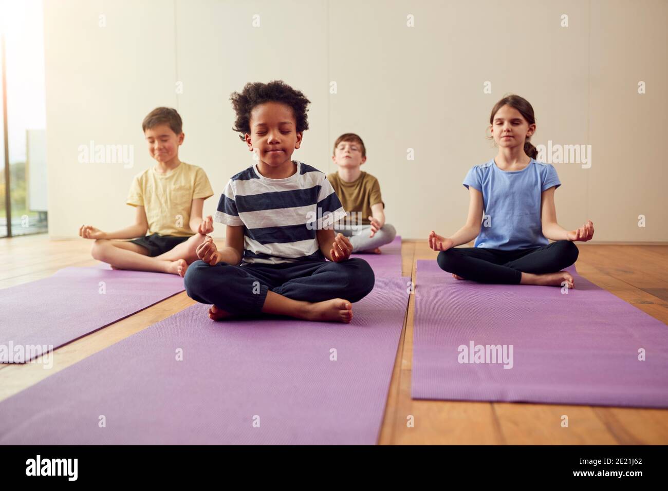 Children sitting exercise mat hi-res stock photography and images - Alamy