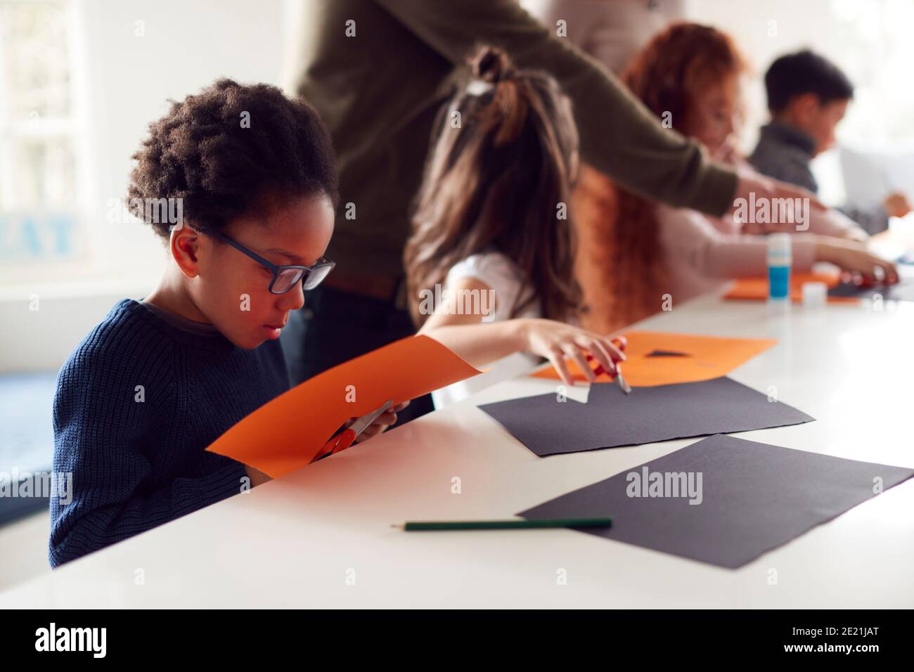 Group Of Children At Home With Parents Having Fun Making Craft Together ...