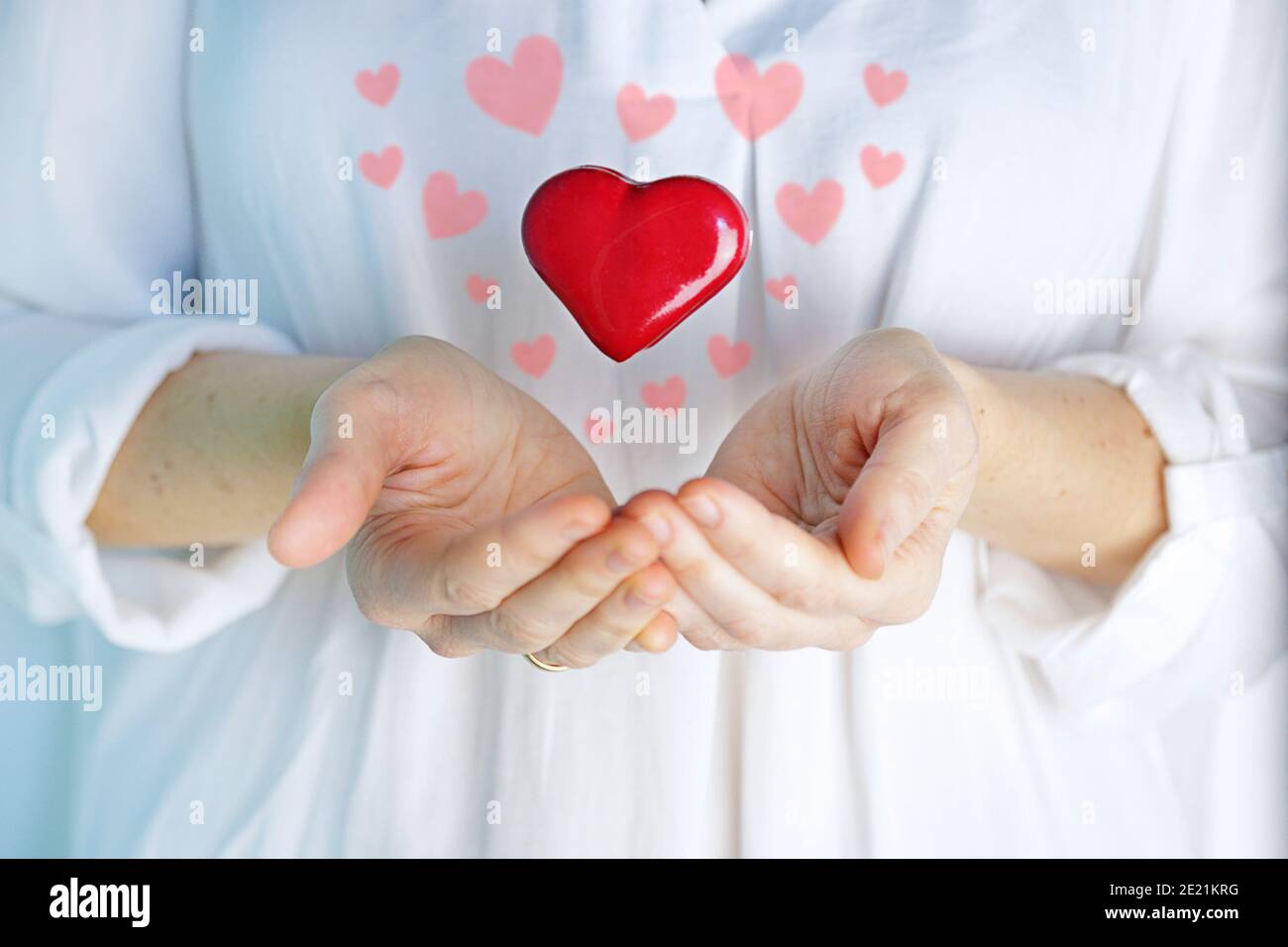 Outstretched hand with heart hi-res stock photography and images - Alamy