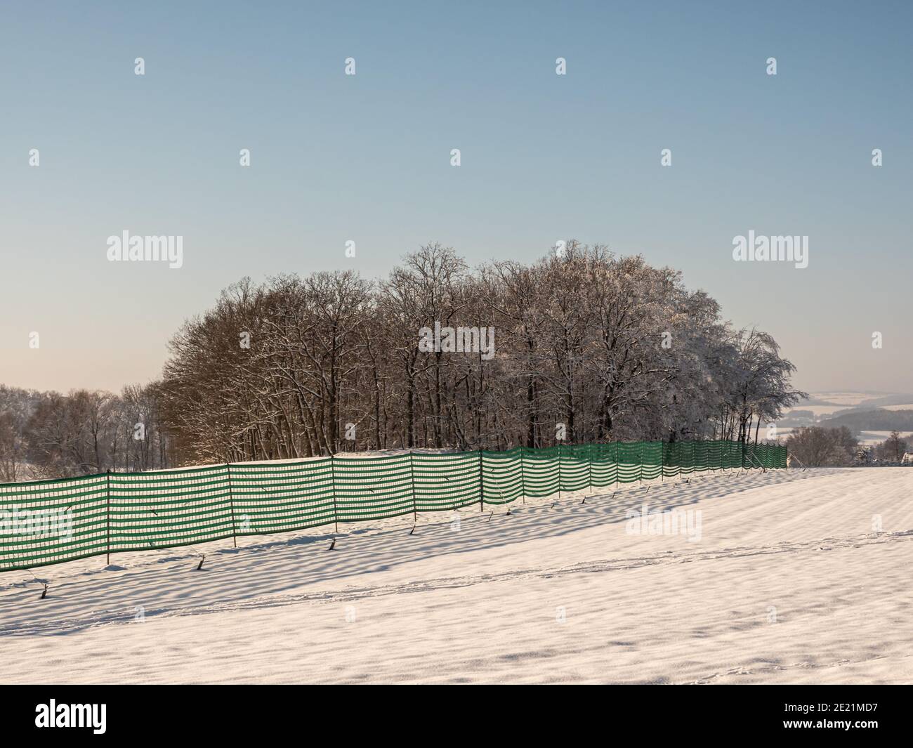 Snow safety fence for road traffic Stock Photo - Alamy