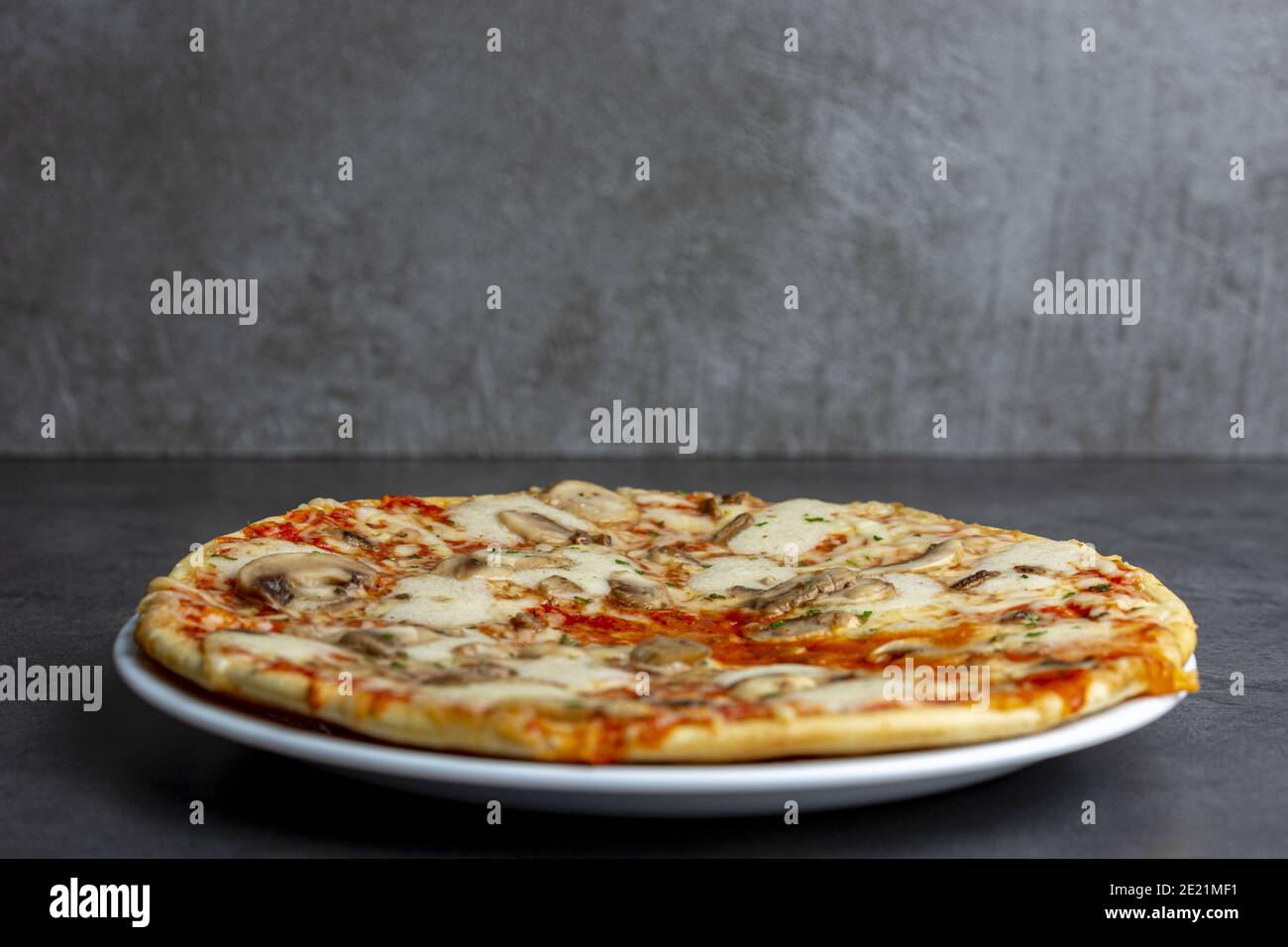 Fresh pizza in modern kitchen Stock Photo - Alamy