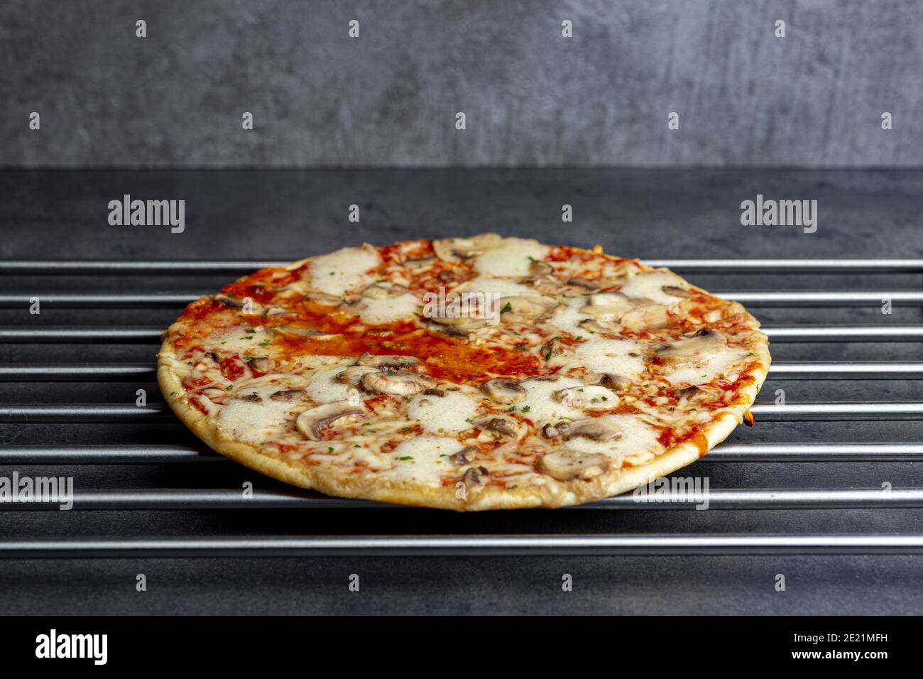Fresh pizza in modern kitchen Stock Photo - Alamy