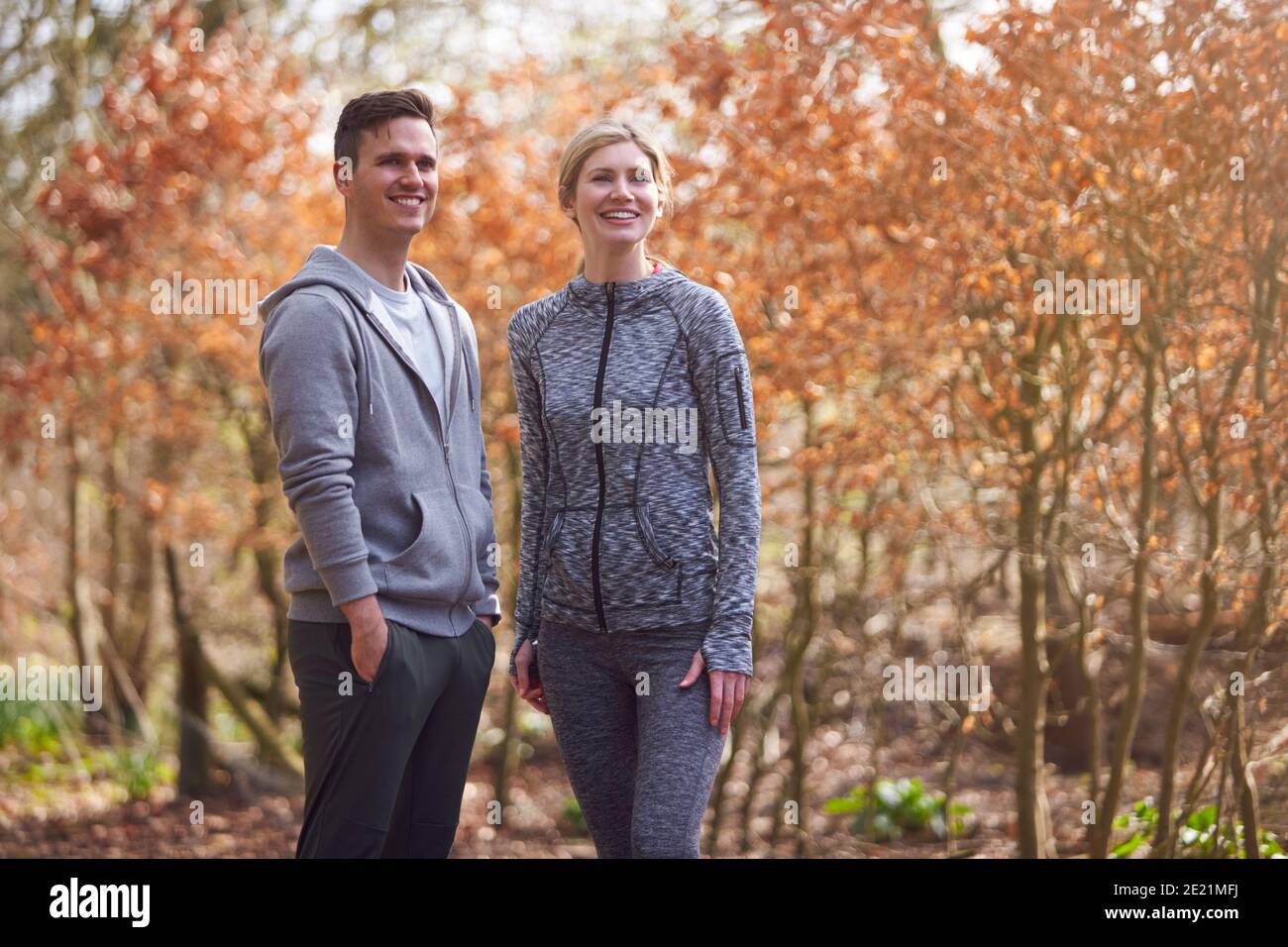 Couple Exercising In Autumn Countryside During Covid 19 Lockdown Stock ...