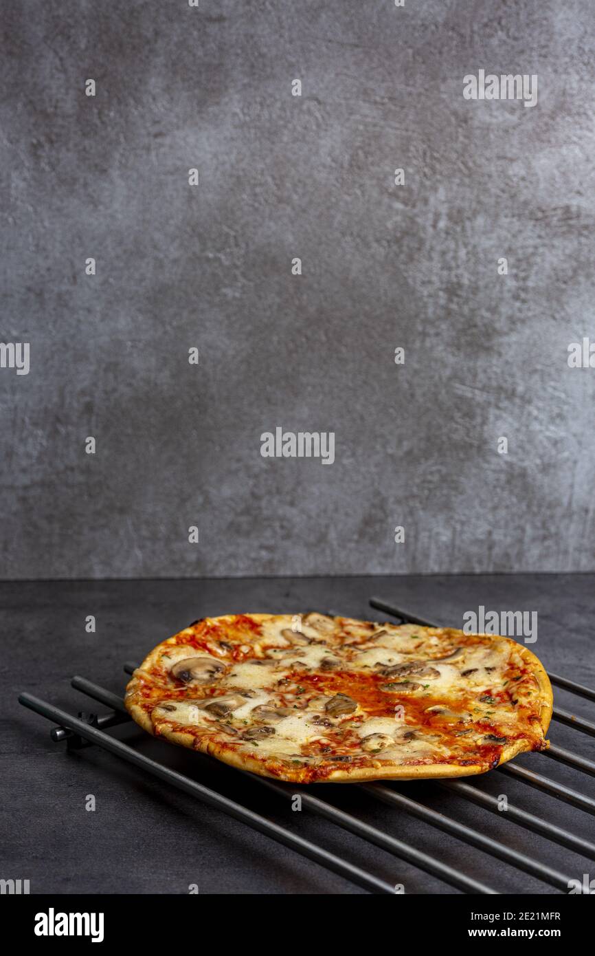 Rustic modern gray kitchen with tasty colorful pizza Stock Photo - Alamy