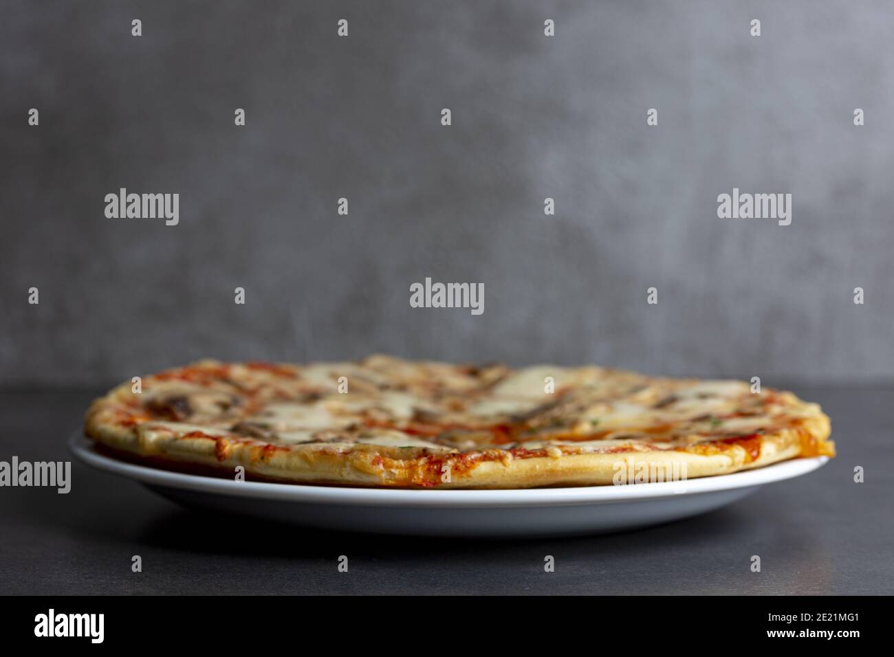 Fresh pizza in modern kitchen Stock Photo - Alamy