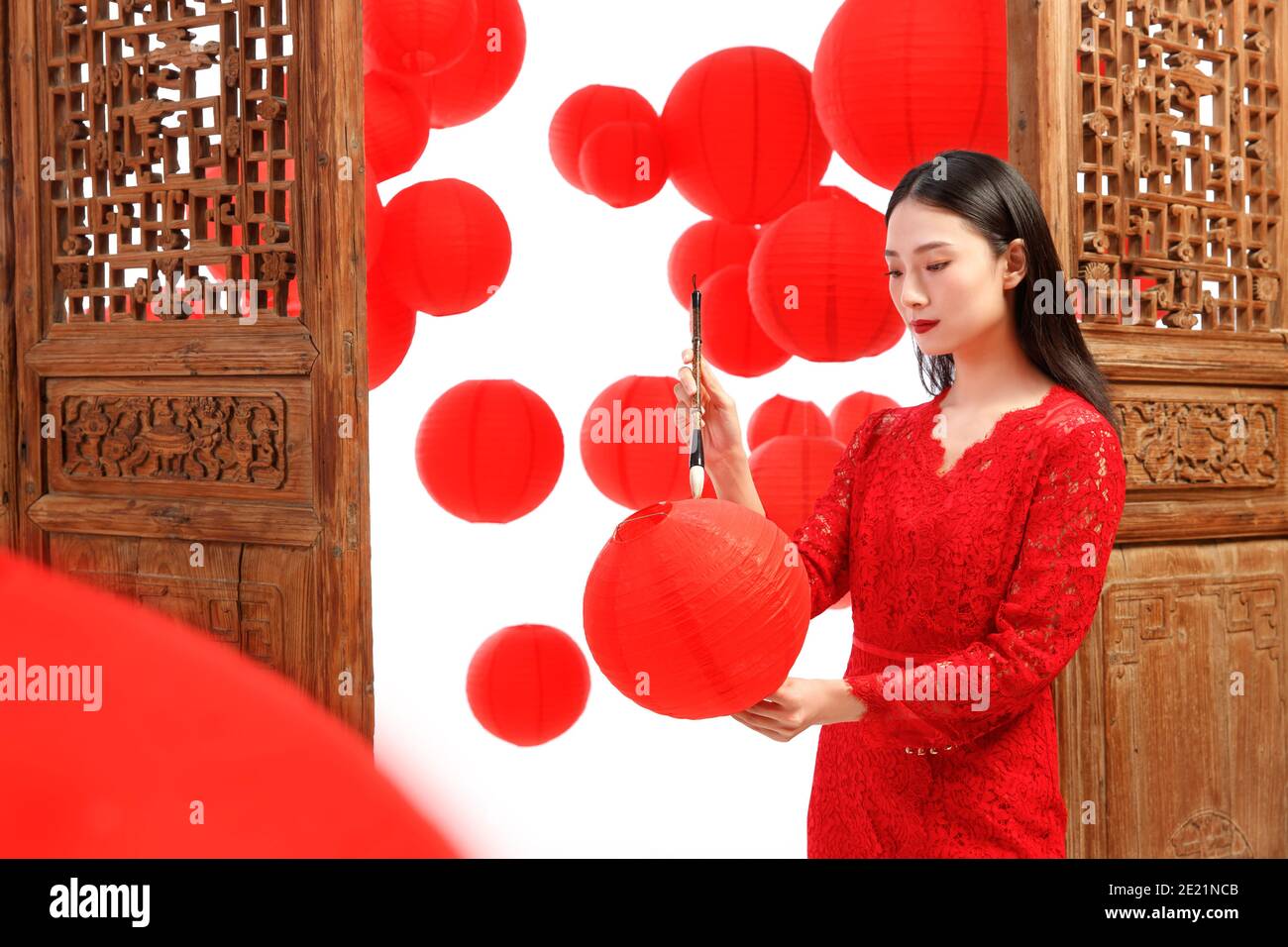 The beautiful women writing in red lanterns Stock Photo - Alamy