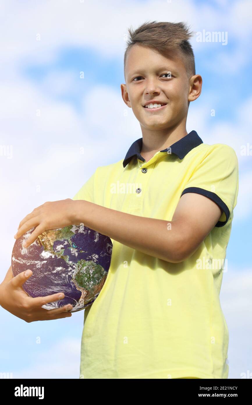 man holding planet earth in his hands. Elements of this image furnished ...