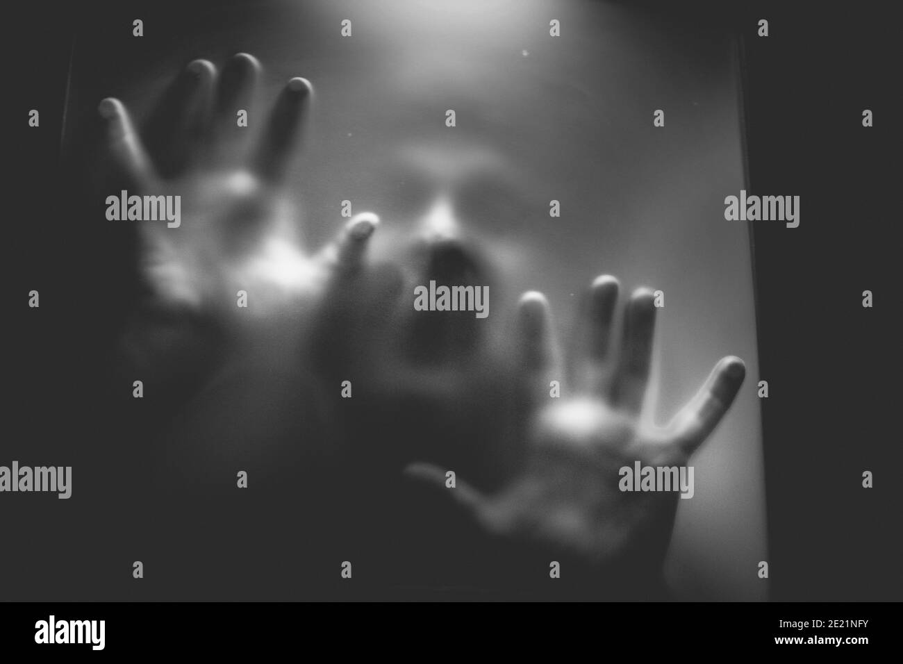 scary picture of hands behind glass Stock Photo - Alamy