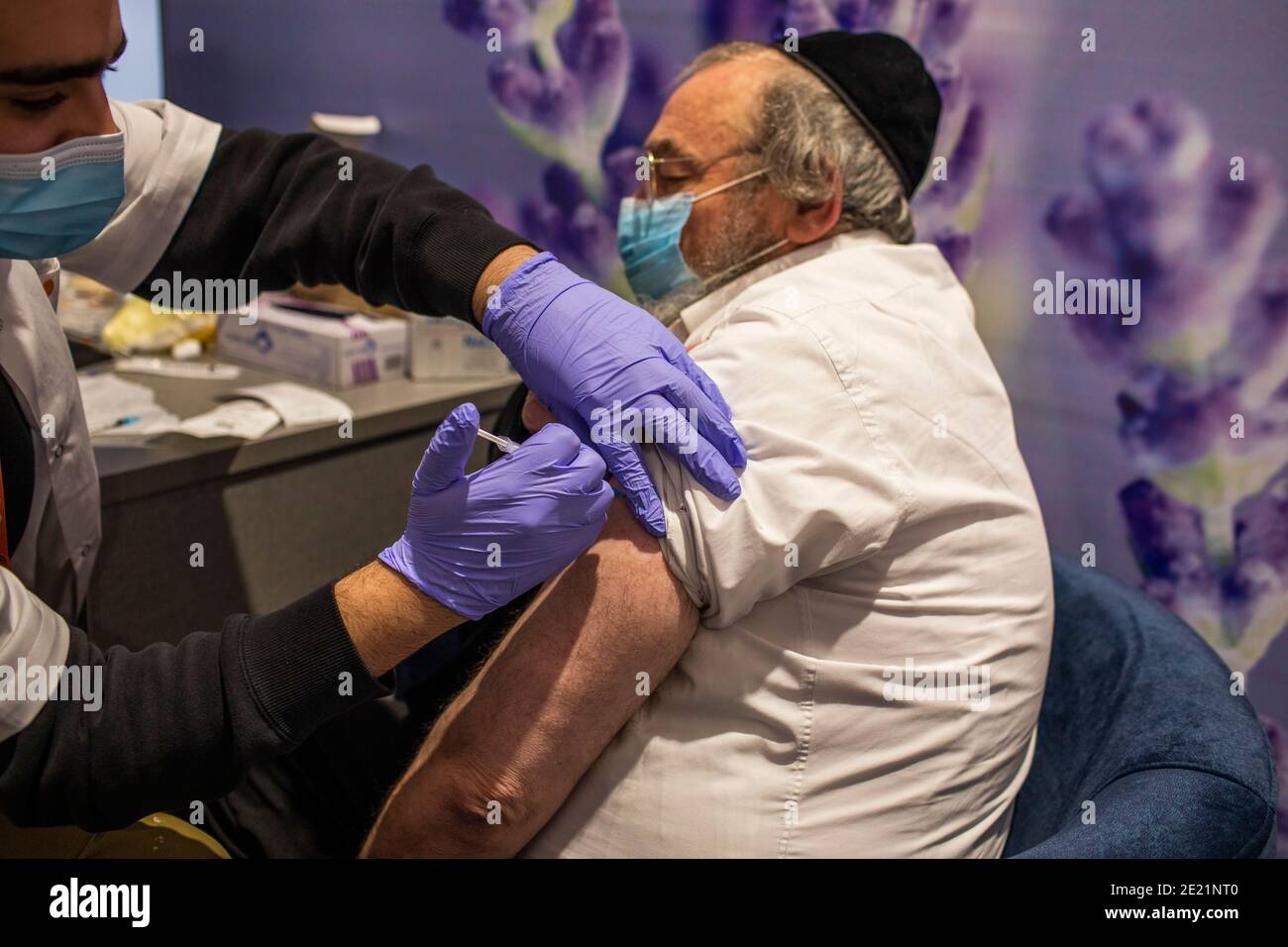 Jerusalem, Israel. 11th Jan, 2021. An Orthodox Jewish man receives his ...