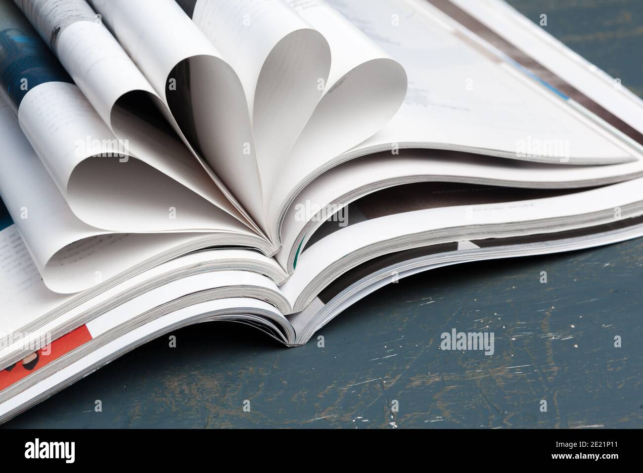 Close up stacking magazine place on table background Stock Photo - Alamy