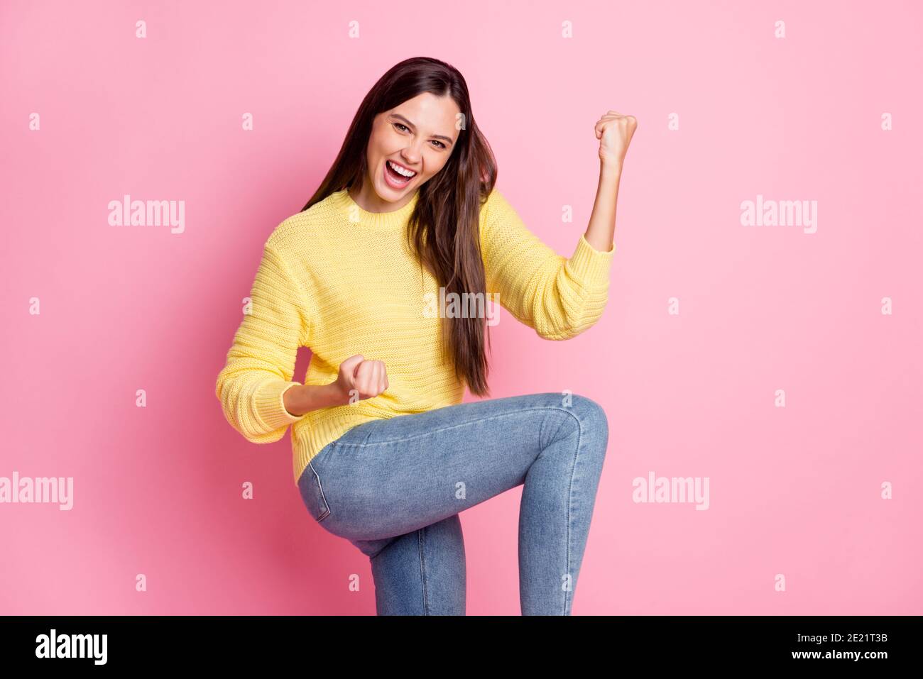 Photo of young beautiful crazy smiling excited positive girl hold fists ...