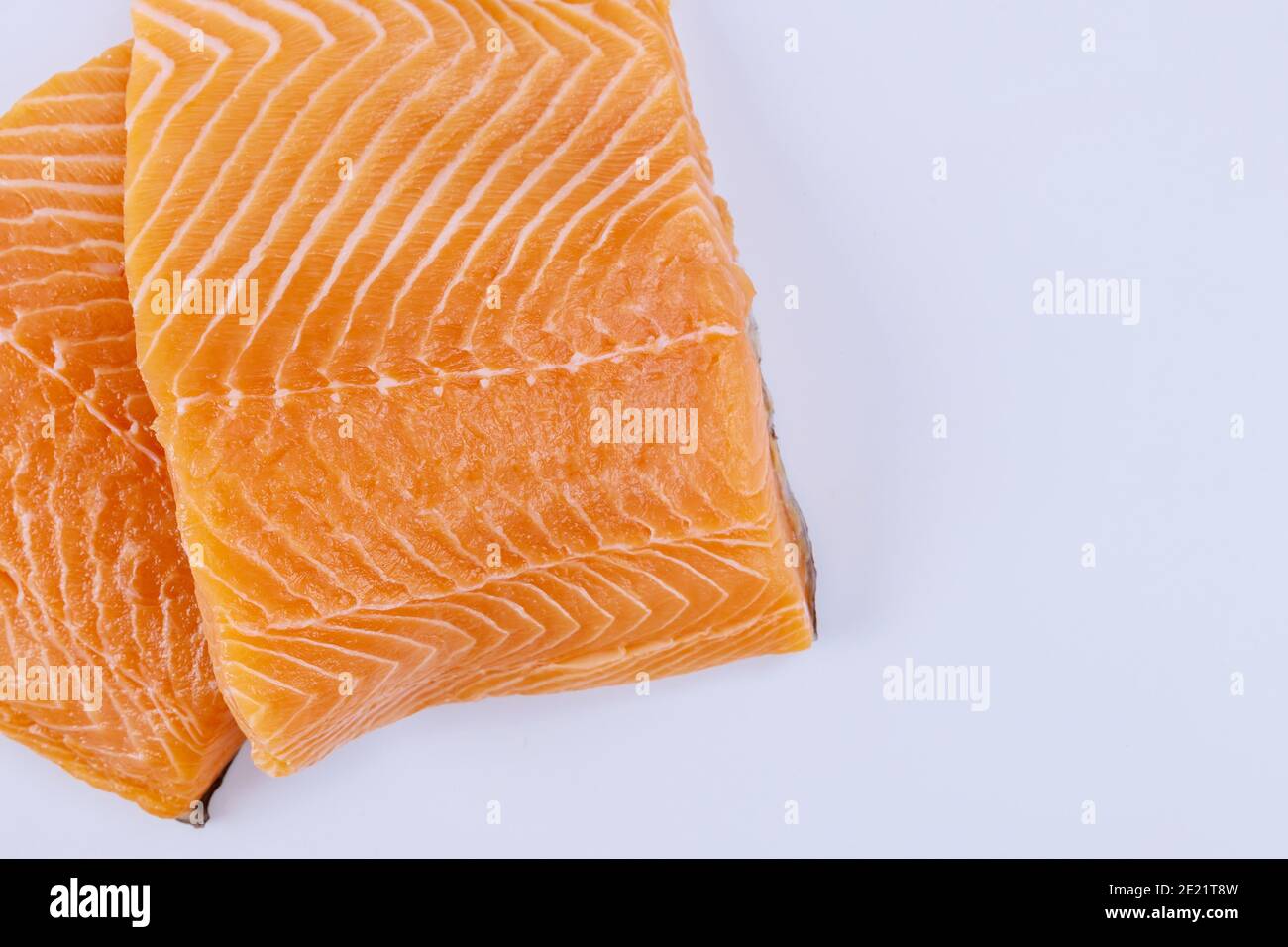 Two fillets raw salmon on isolated white background Stock Photo - Alamy