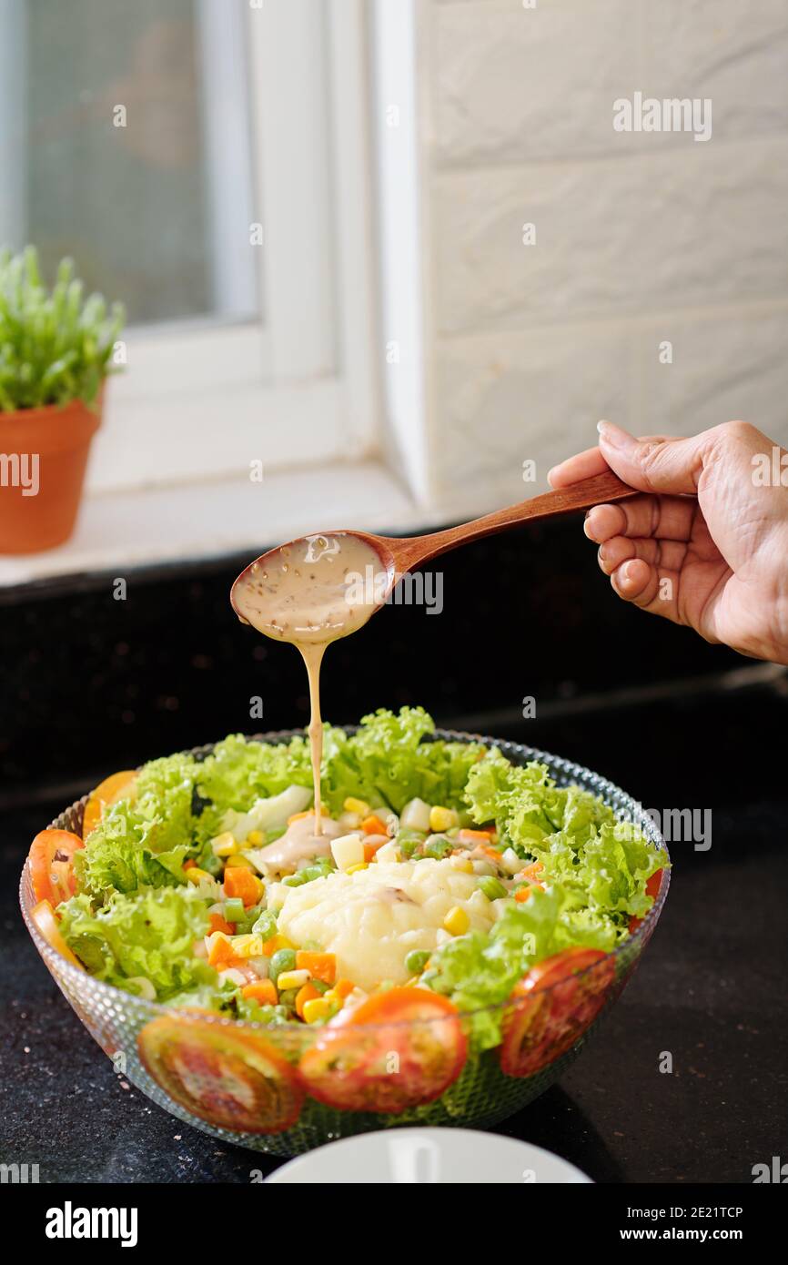 Mixing dressing hi-res stock photography and images - Alamy