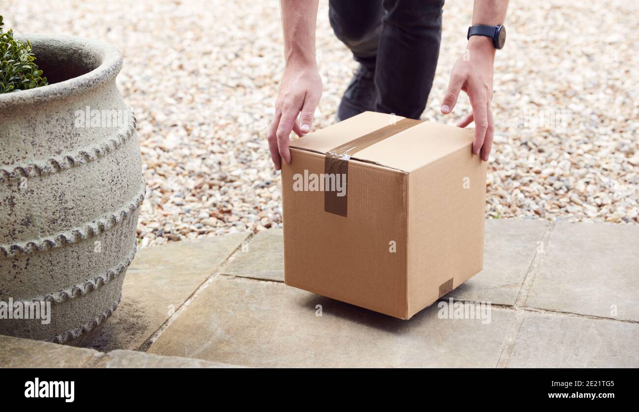 Package delivery on a doorstep hi-res stock photography and images - Alamy