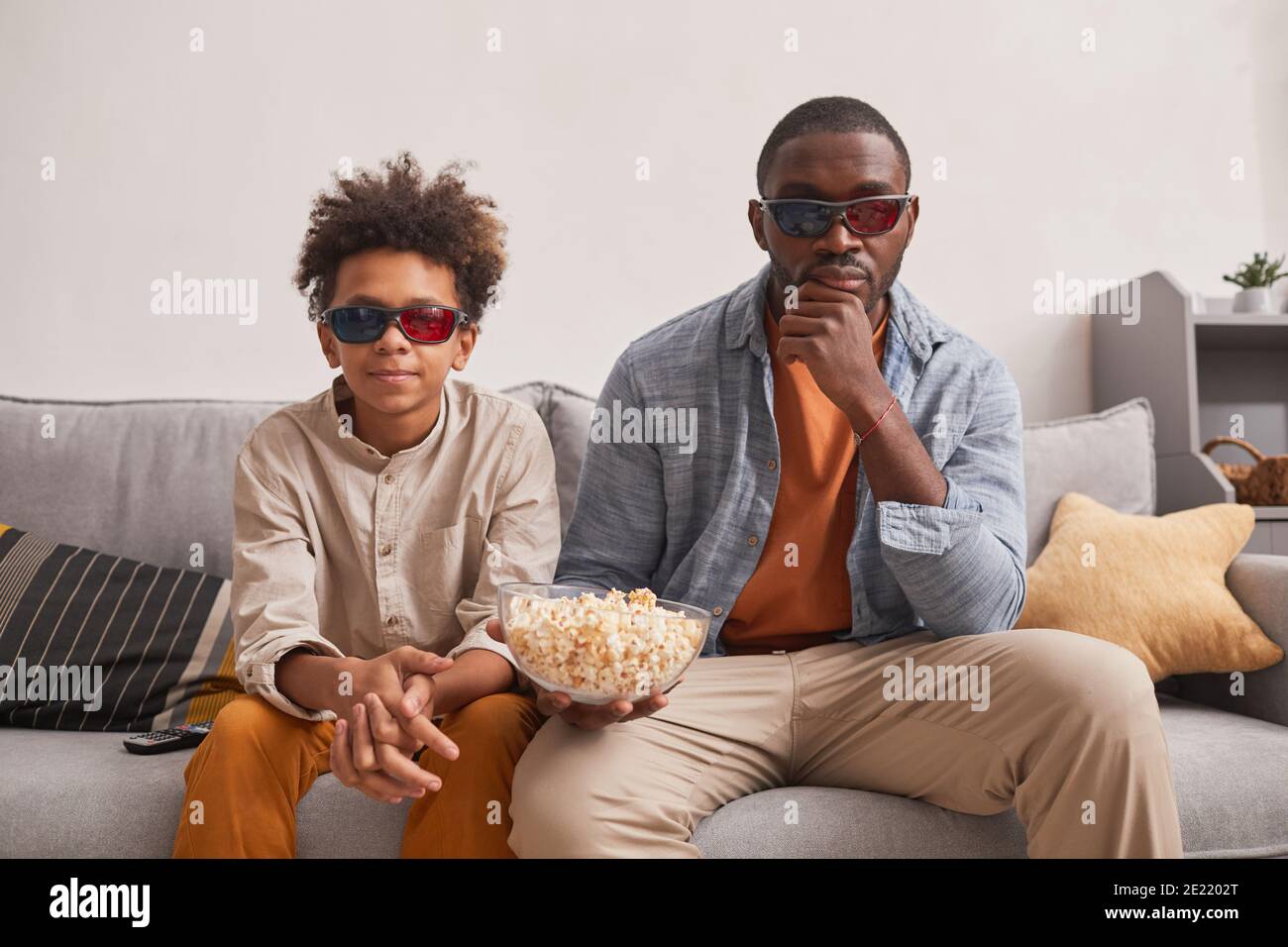 Boy eating popcorn watching movie hi-res stock photography and images - Alamy