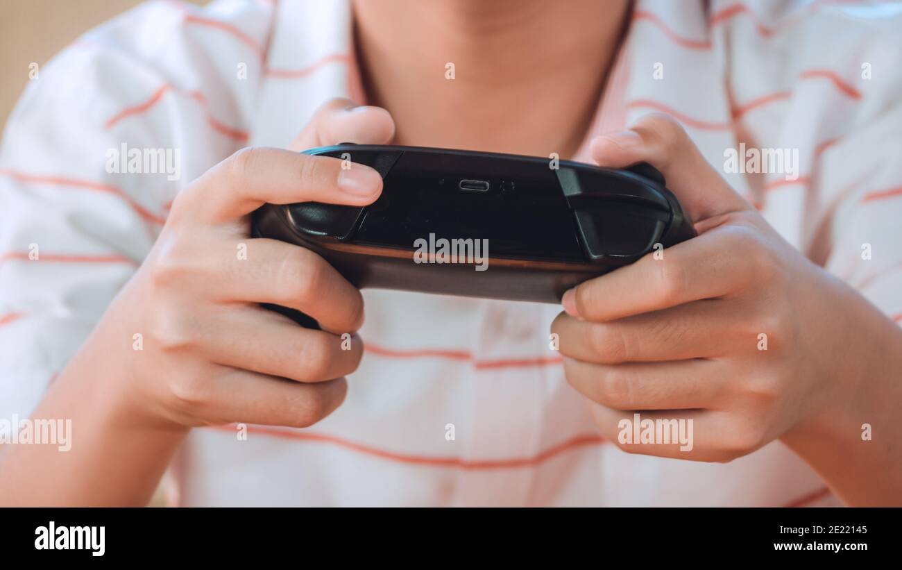 Asian kids playing video game hi-res stock photography and images - Alamy