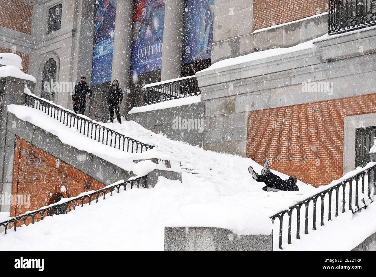 Some neighbors play in the Museo del Prado stairs during 'Filomena ...