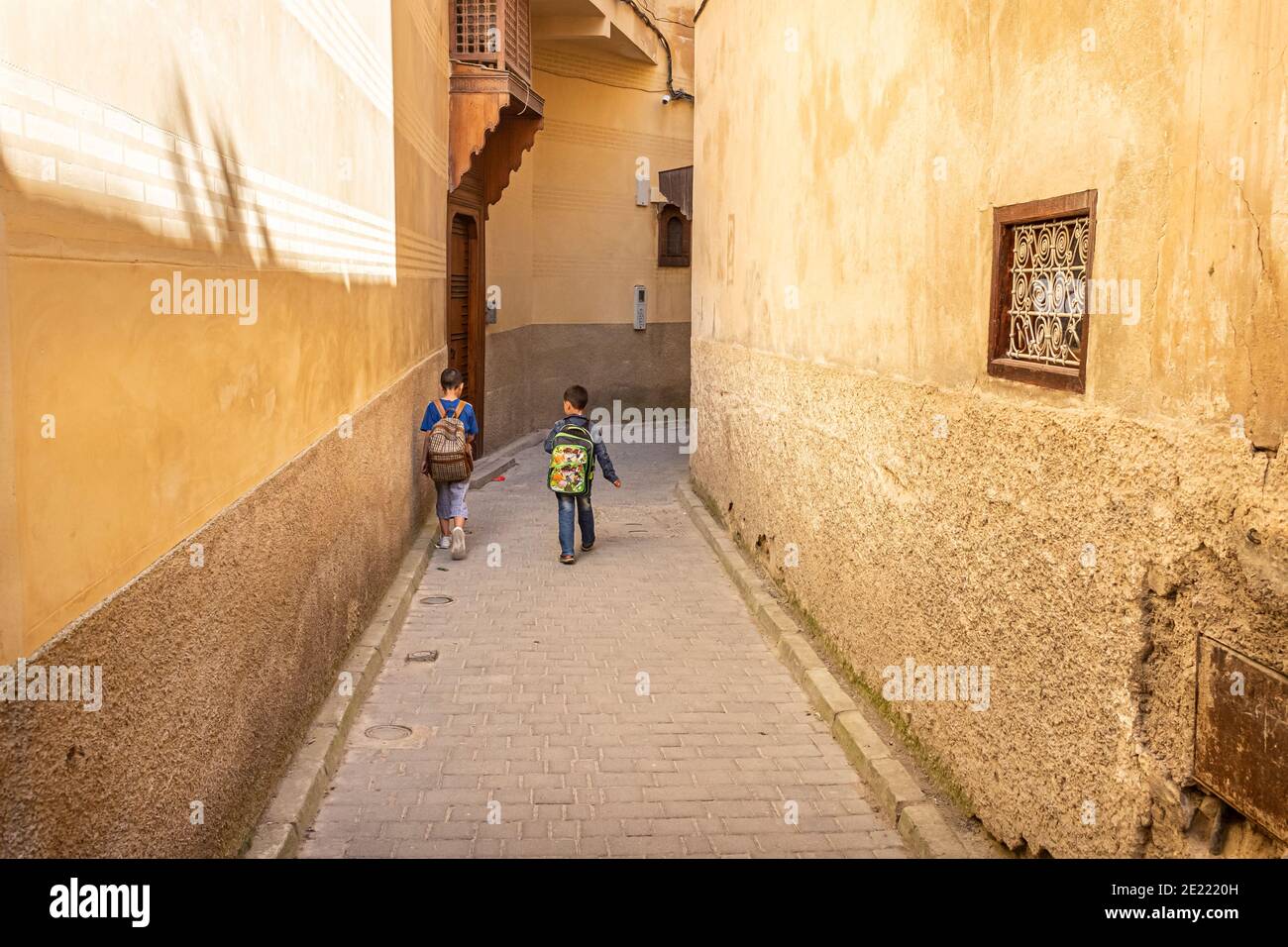 Two boys walking to school hi-res stock photography and images - Alamy