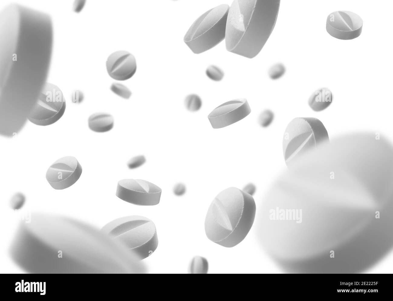 White round tablets levitate on a white background Stock Photo - Alamy