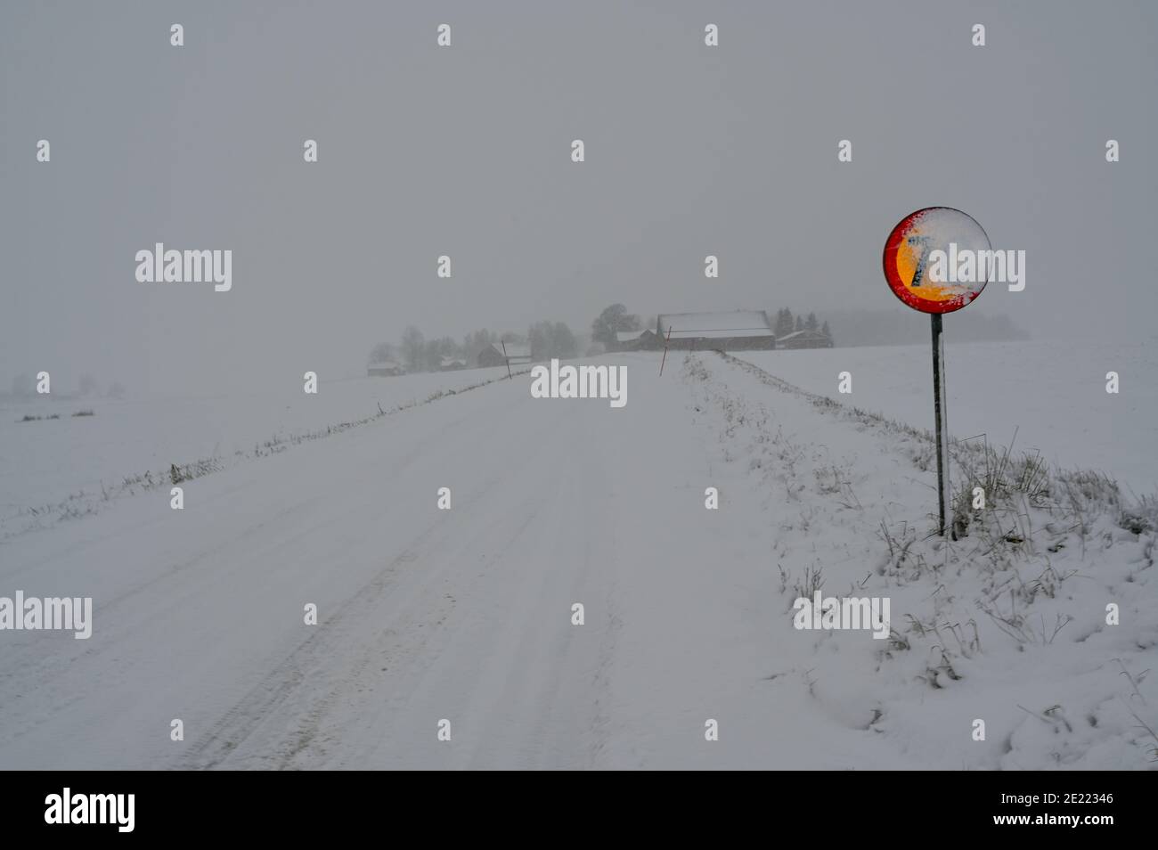 speed sign with 70 kph covered in snow Stock Photo - Alamy