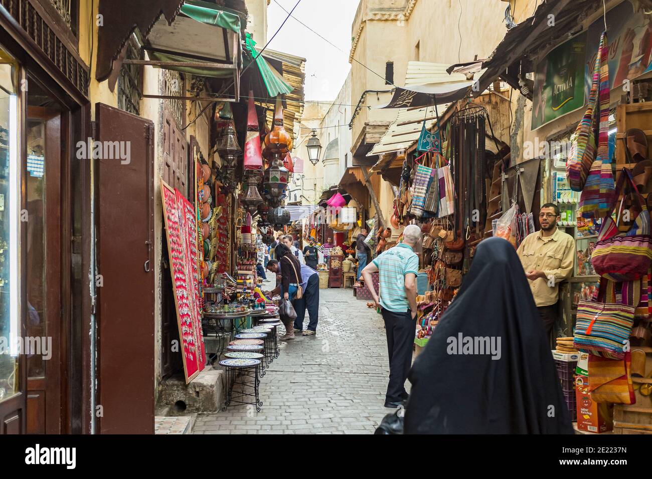 The busy and crowded souk in the Medina of Fes in Morocco Stock Photo ...