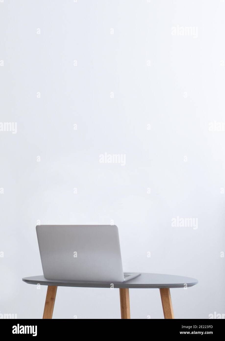 Gray small table with modern laptop in office or workplace in living ...