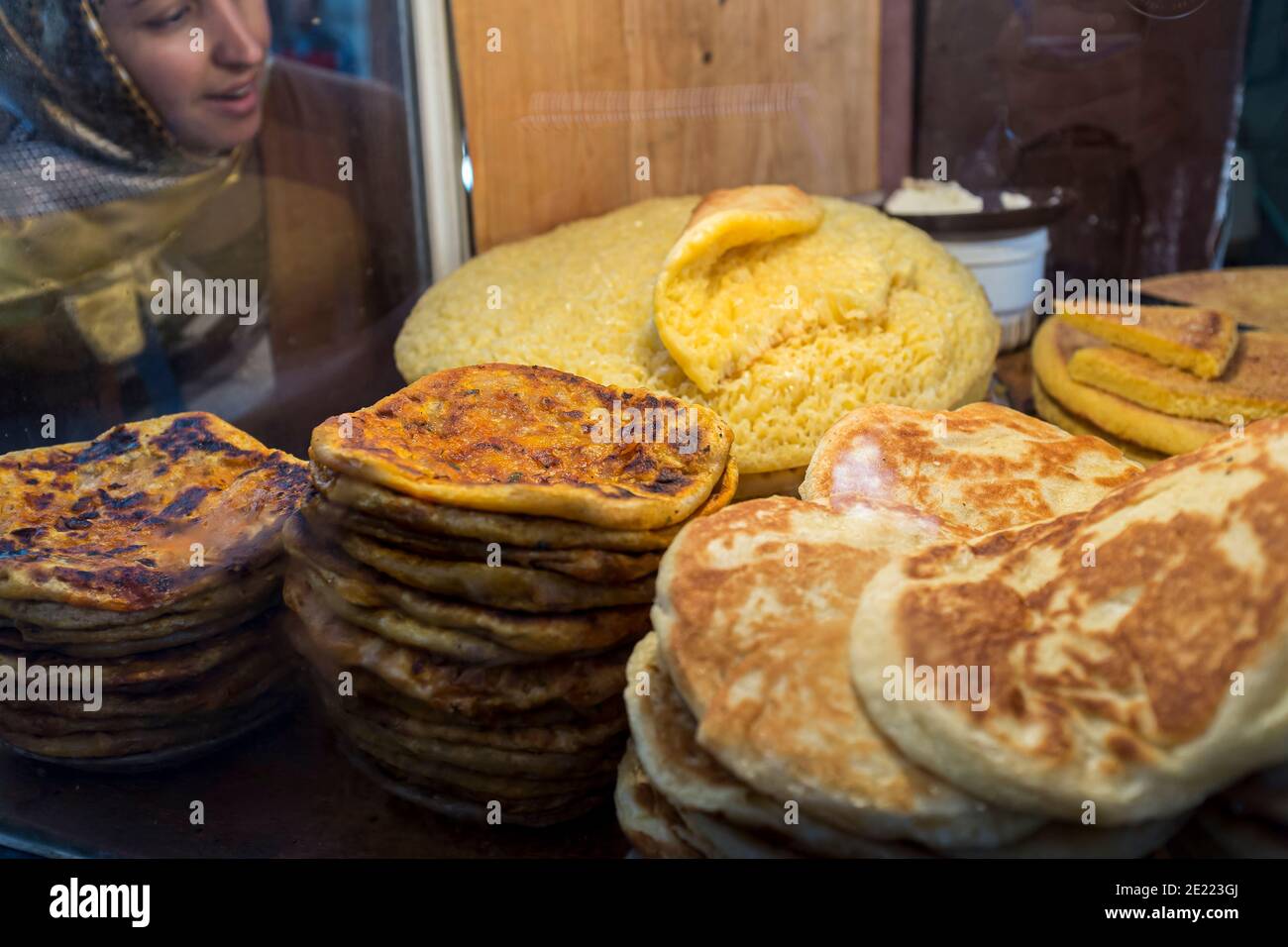 Moroccan bakery goods for sale in the Medina of Fez including beghrir ...