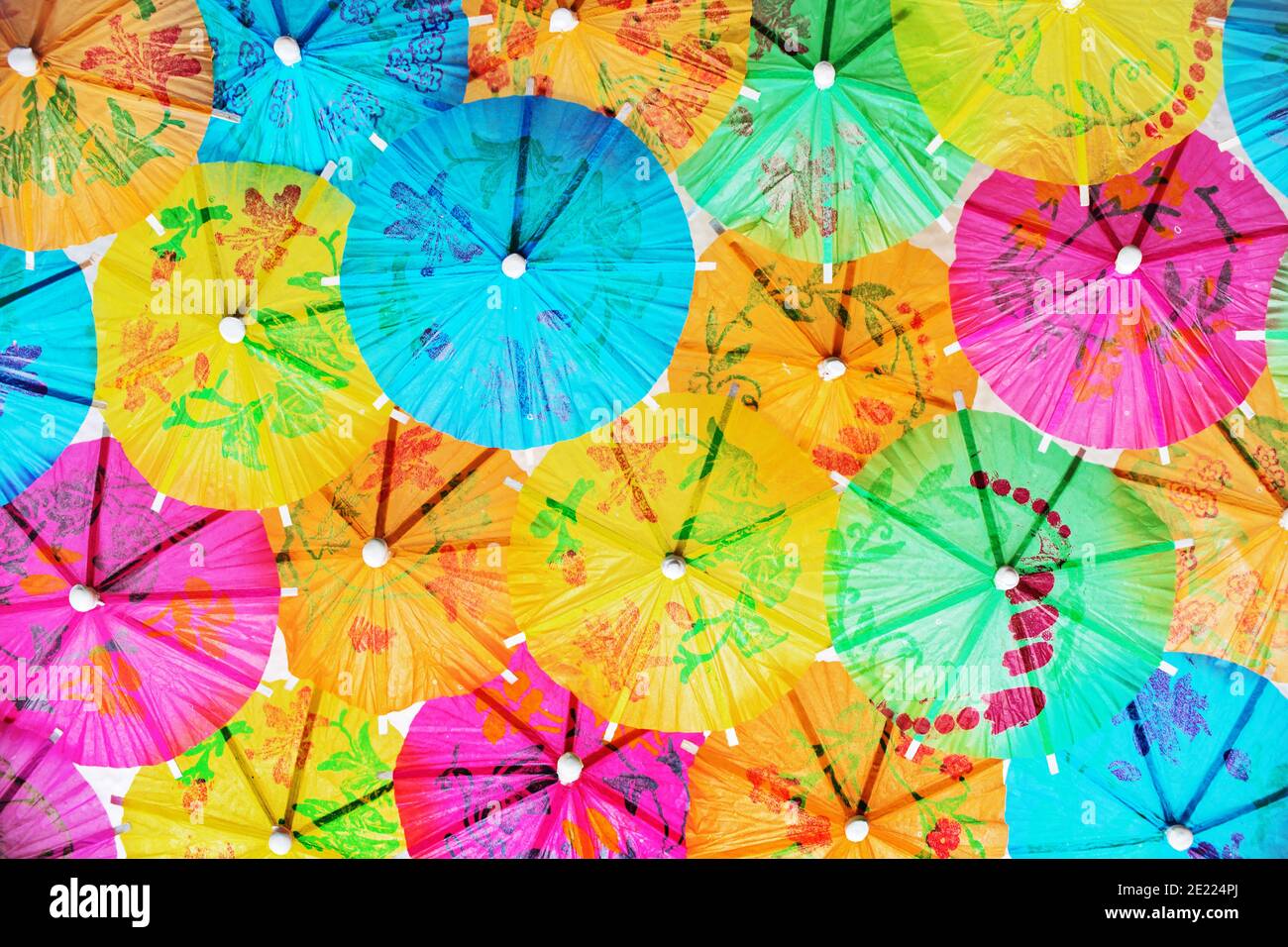 Colorful background of paper cocktail umbrellas Stock Photo - Alamy