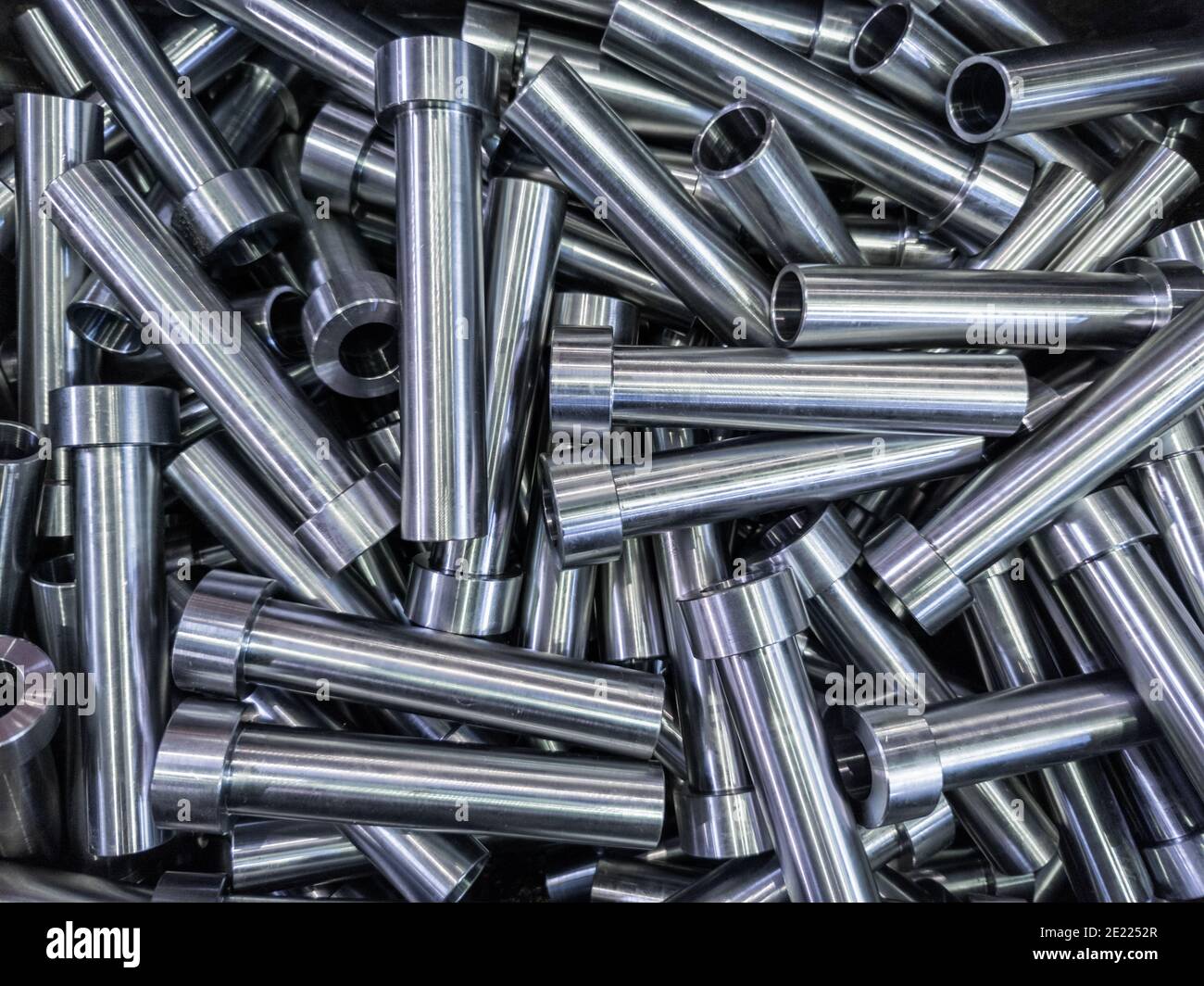 full frame abstract indistrial background of pile of shiny steel tubes ...
