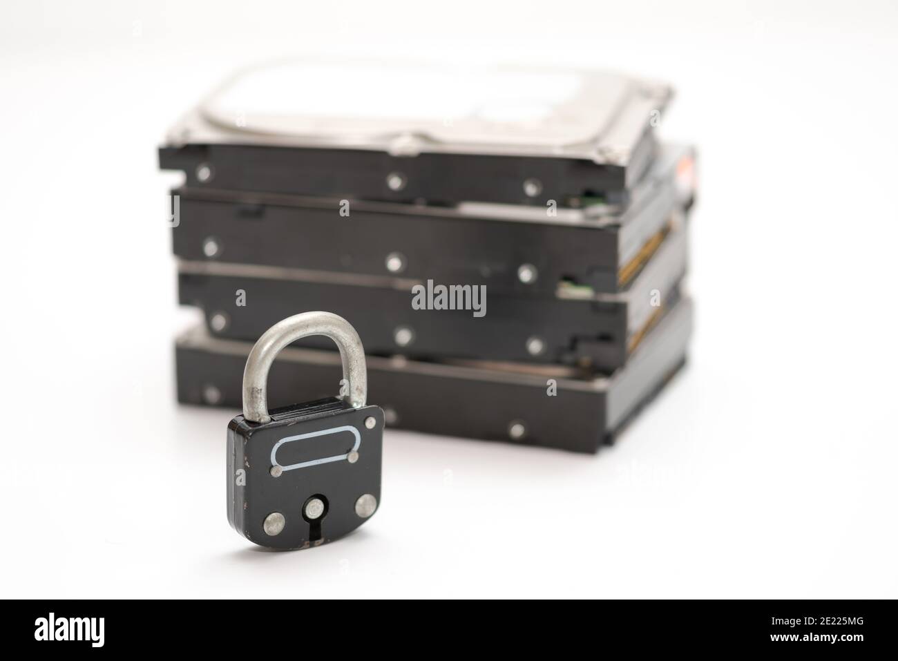 Computer hard disks and metal padlock symbolizing concept for encrypted ...