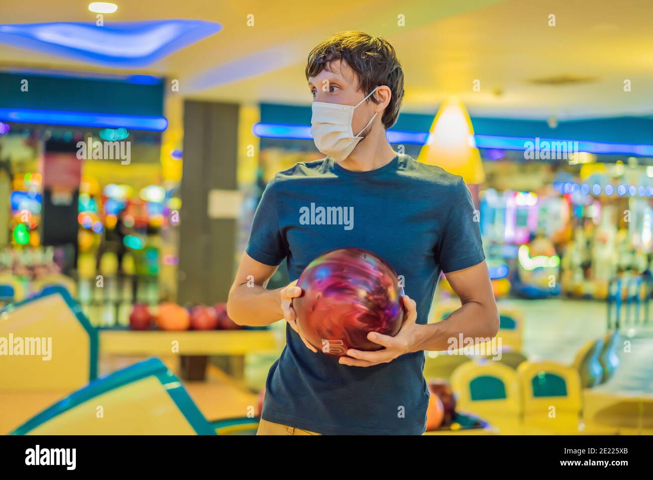 Man playing bowling with medical masks during COVID-19 coronavirus in ...