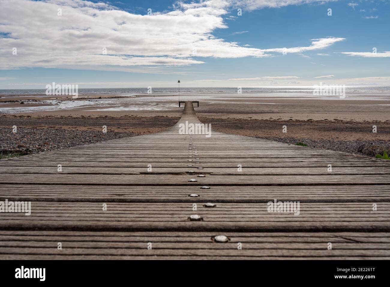 The beach and a wooden walkway in Seascale, Cumbria, England, UK Stock ...