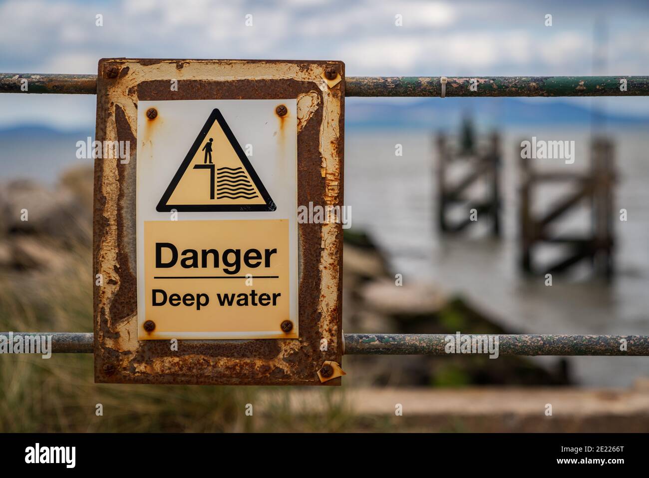 Sign: Danger, Deep Water - with blurry background, seen in Silloth ...