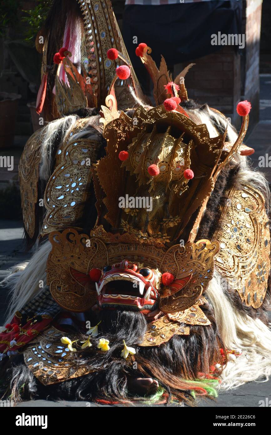 Balinese locals performing Barong, a mythical lion-like creature at a ...