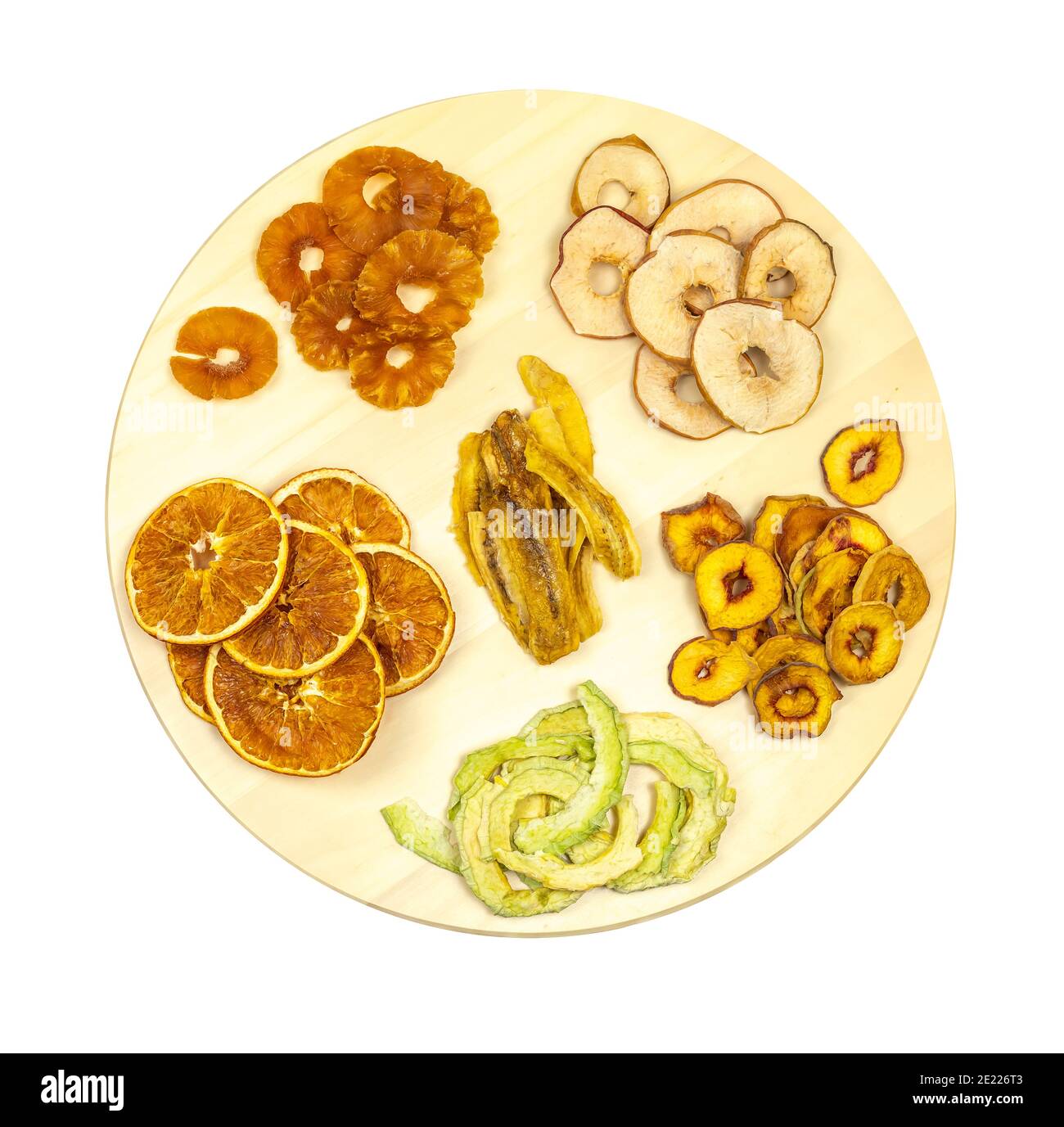 Isolated tray with dried slices of orange, apple, pineapple, peach and ...