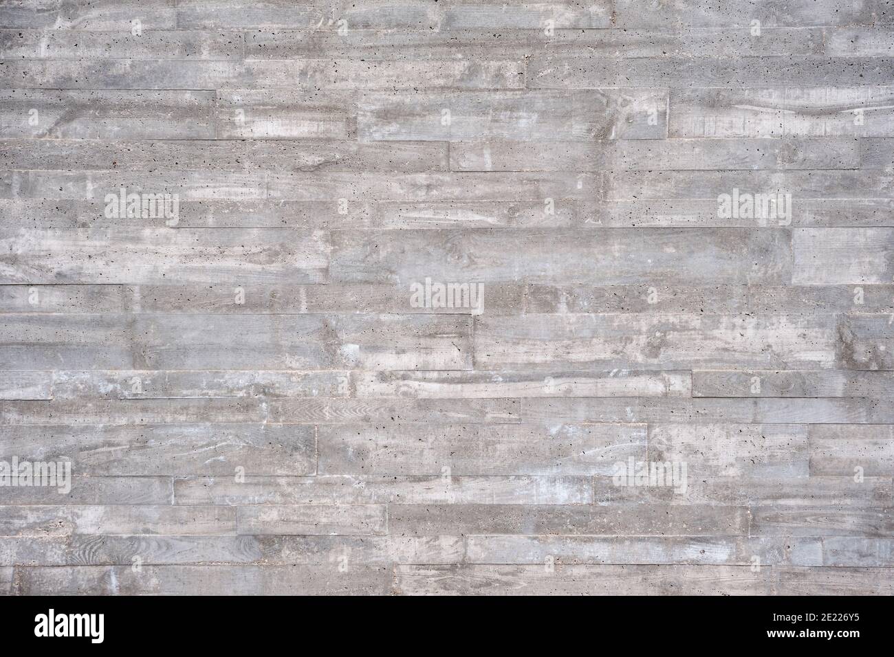 Formwork raw concrete wall with wood impression Stock Photo - Alamy