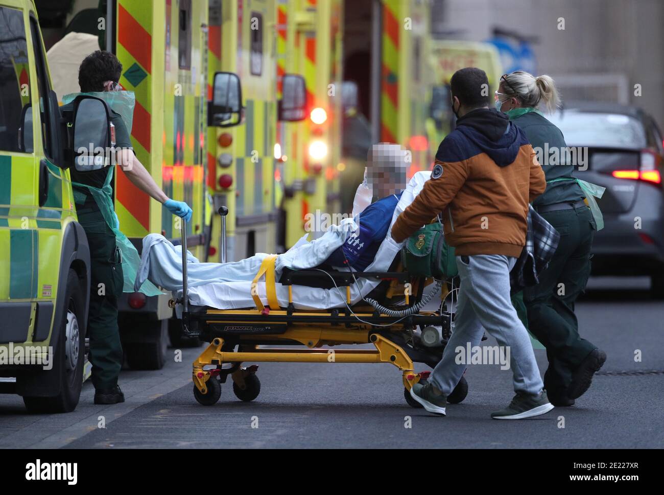 FACE PIXELATED BY PA PICTURE DESK Paramedics and hospital staff attend ...