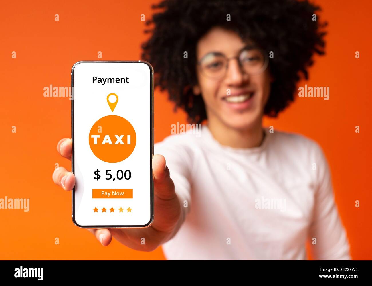 Cheerful black guy holding smartphone with taxi payment transaction on ...