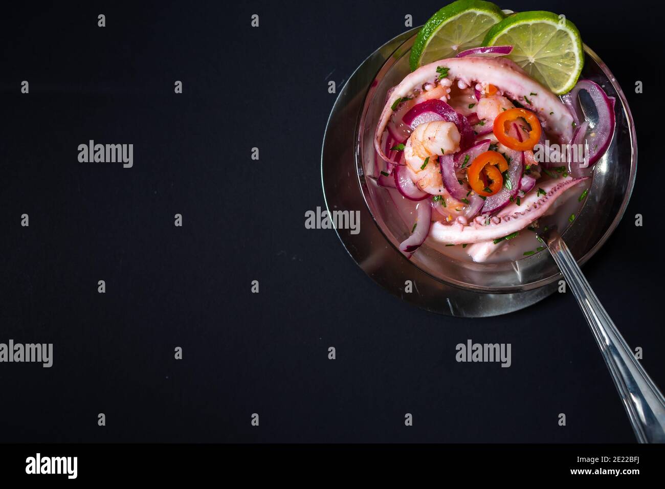 Typical Peruvian food, ceviche with squid, shrimp and white fish with ...