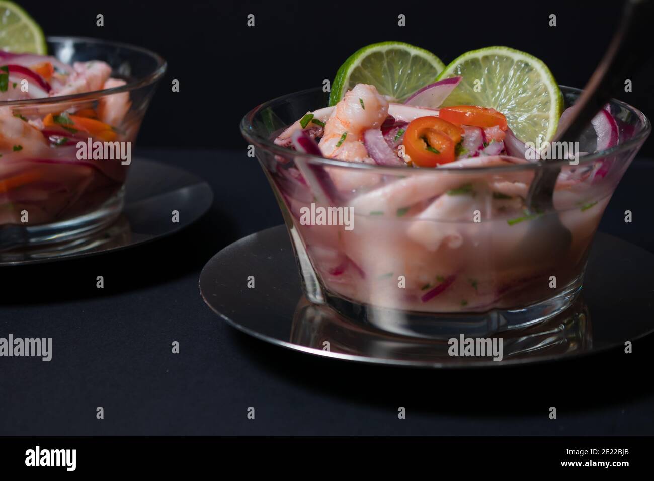 Typical Peruvian food, ceviche with squid, shrimp and white fish with ...