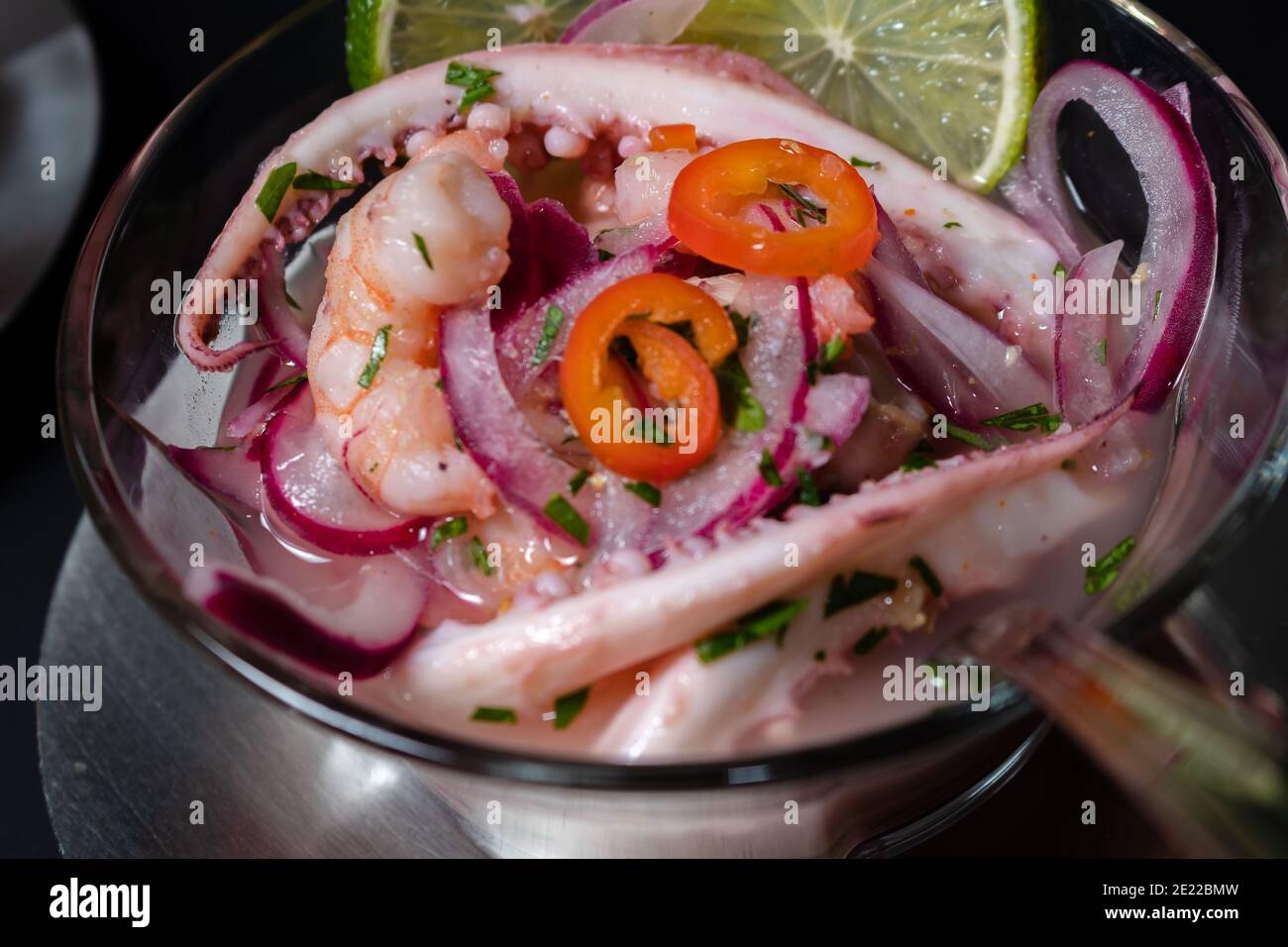 Typical Peruvian food, ceviche with squid, shrimp and white fish with ...