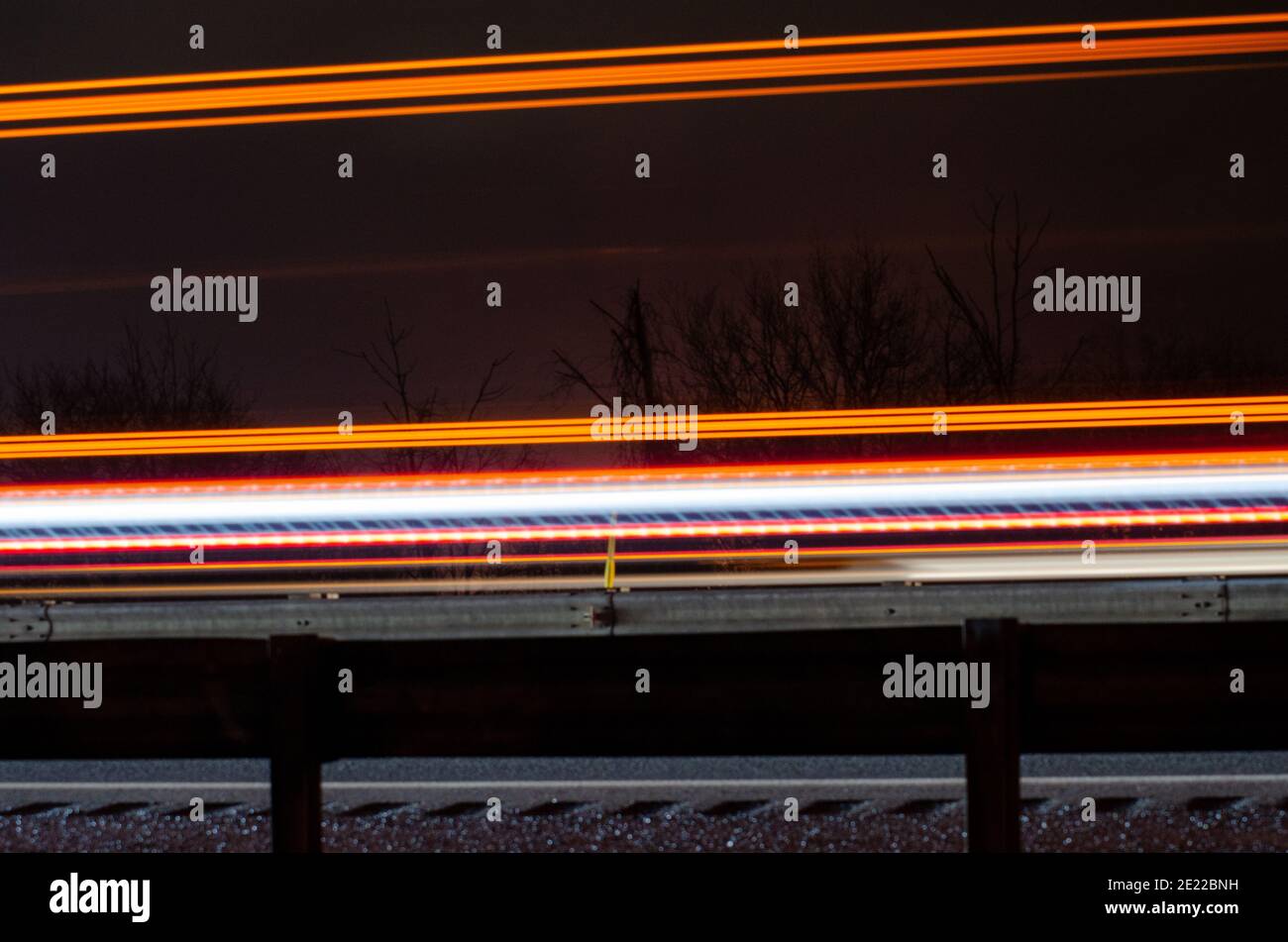 Light trails along a highway at night Stock Photo - Alamy