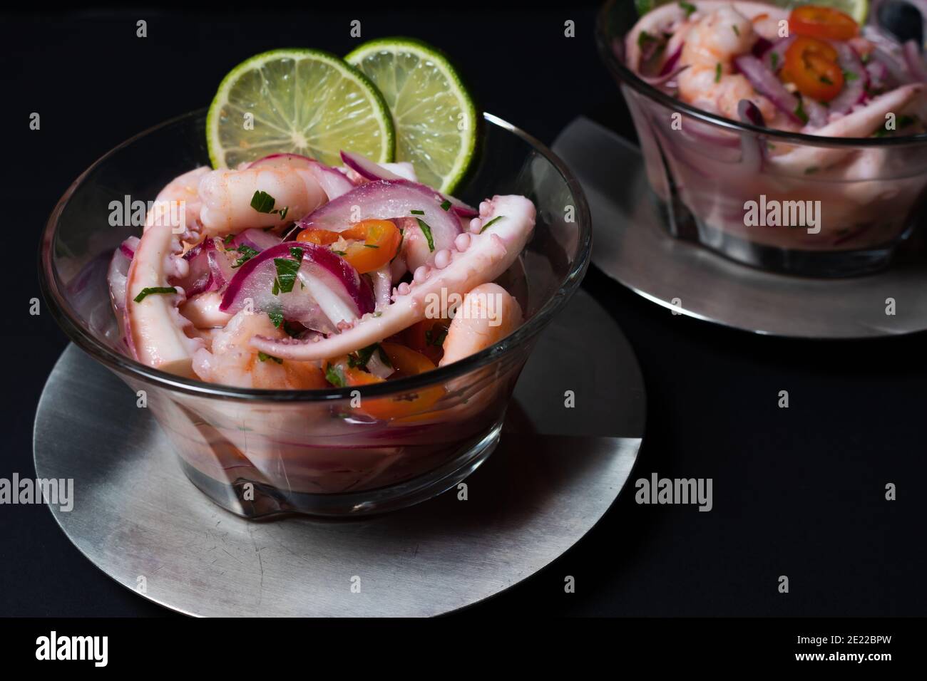 Typical Peruvian food, ceviche with squid, shrimp and white fish with ...