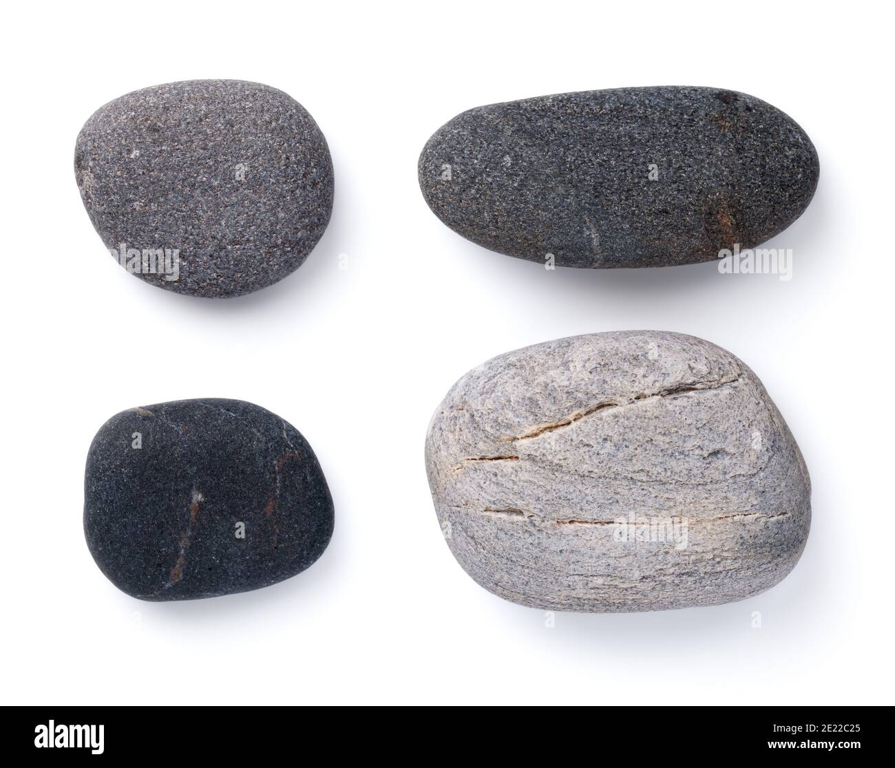 Set of various grey pebble stones isolated on white background. View ...