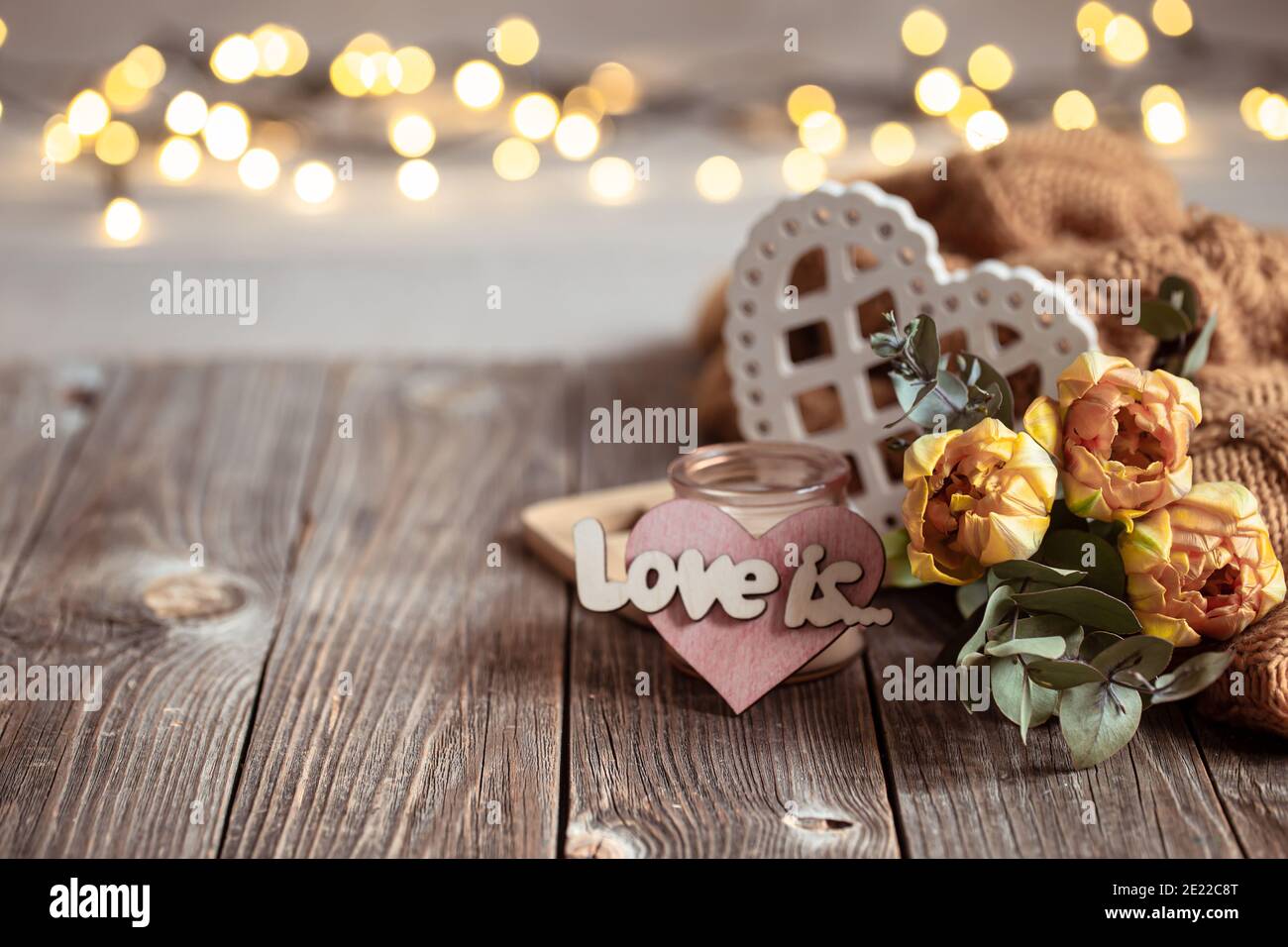 Festive still life love it with flowers and decor details on a wooden ...