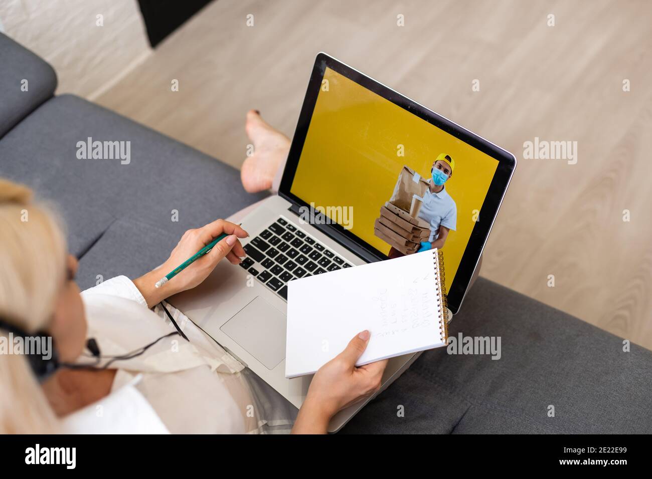ordering food online concept: woman with a laptop showing fast food ...