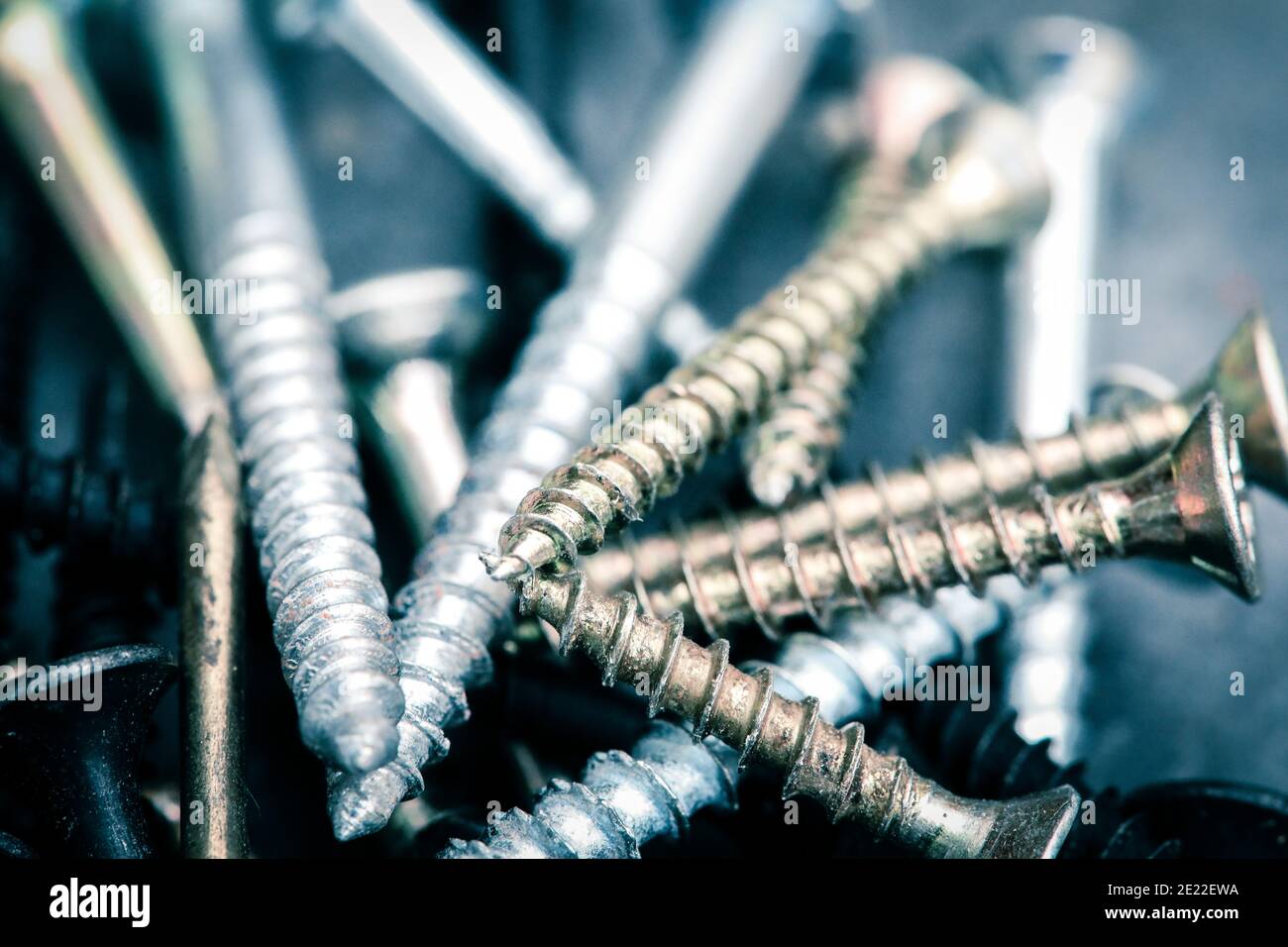 Different Kind of Screws on a table in a workshop Stock Photo - Alamy