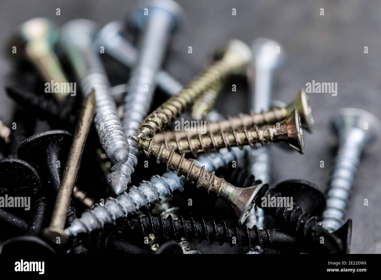 Different Kind of Screws on a table in a workshop Stock Photo - Alamy